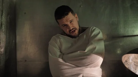 Psycho, crazy man in a straitjacket in a... | Stock Video | Pond5