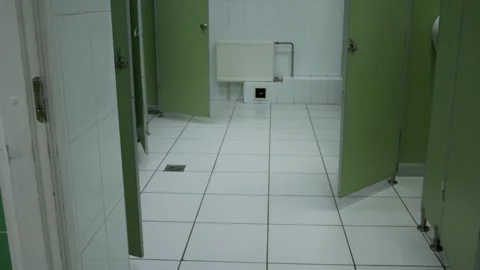 Public toilet. Open stalls in restroom. ... | Stock Video | Pond5