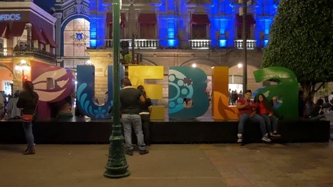Puebla symbol letters with people at nig... | Stock Video | Pond5