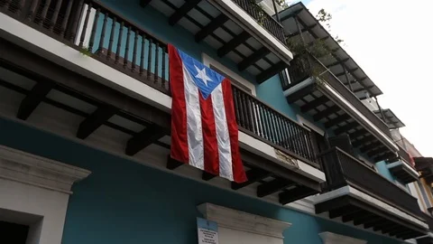 Puerto Rico Flag Hanging On Balcony Trac... | Stock Video | Pond5