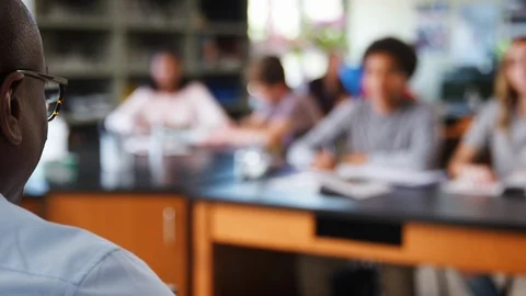 Pull Focus Shot Of Male High School Tuto... | Stock Video | Pond5