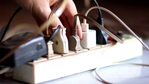 Pull out the one plug from the extended ... | Stock Video | Pond5