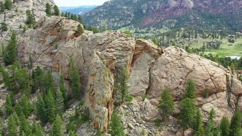 Pulling away from the rock face to revea... | Stock Video | Pond5