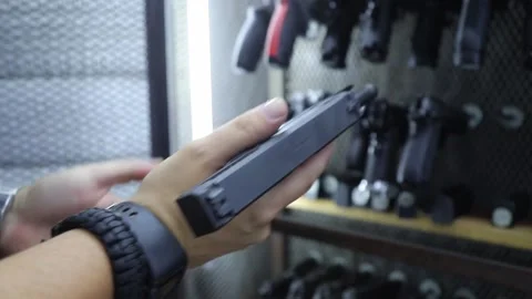 Pulling back and locking the slide on an... | Stock Video | Pond5