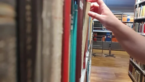 Pulling A Book From The Library Universi... | Stock Video | Pond5