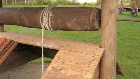 pulling a bucket full of water from the ... | Stock Video | Pond5