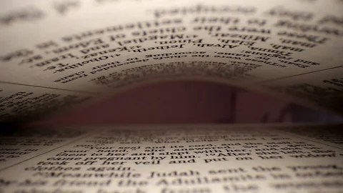 Pulling a lens out of a book centered on... | Stock Video | Pond5
