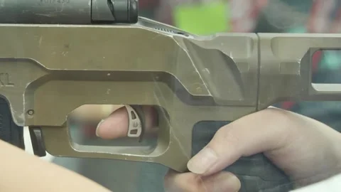 pulling the trigger at shooting range be... | Stock Video | Pond5