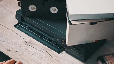 Pulls out VHS Tape Cassette From a Vinta... | Stock Video | Pond5