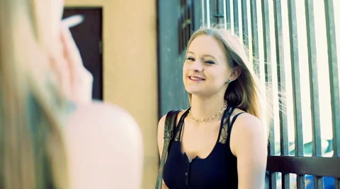 Punk girl smoking cigarette and talking ... | Stock Video | Pond5