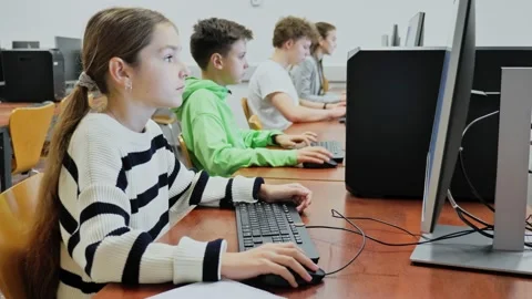 Pupils using computers at lesson, teache... | Stock Video | Pond5