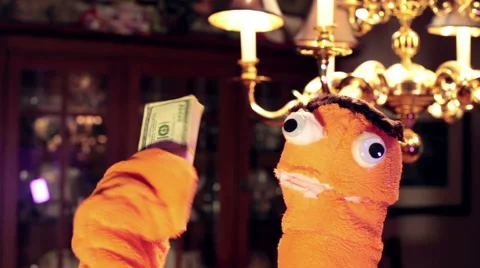 puppet holding money hold cash | Stock Video | Pond5