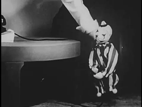 A puppet looks for the voice a telephone... | Stock Video | Pond5