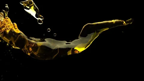 Pure Gold color splash in the air. Shot ... | Stock Video | Pond5