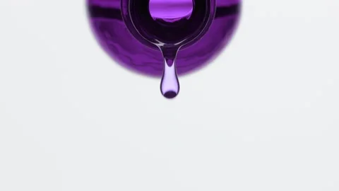 Purple liquid is dripping from purple bo... | Stock Video | Pond5