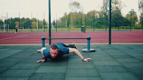 Push-up. Athletic young man pushing off ... | Stock Video | Pond5