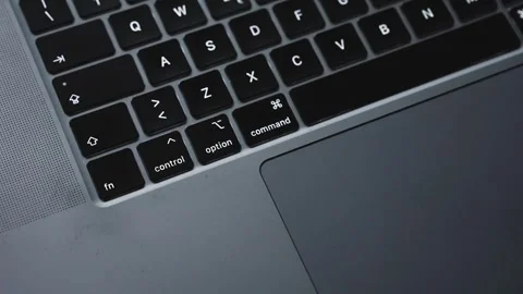 Push in over a notebook keyboard. Keys o... | Stock Video | Pond5