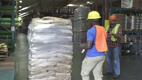 Push-in shot of a worker putting sticker... | Stock Video | Pond5