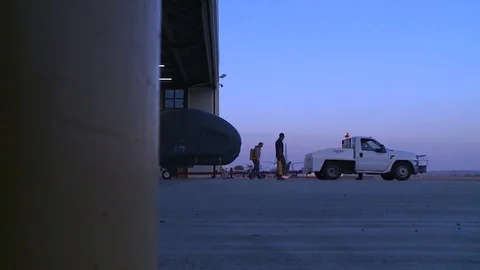 Pushback vehicle tow northrop grumman RQ... | Stock Video | Pond5