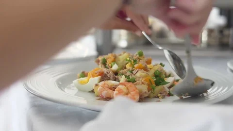 putting food on a plate to serve custome... | Stock Video | Pond5