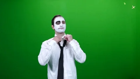 Putting a Tie on a Mime Artist Green Scr... | Stock Video | Pond5