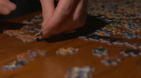 Putting wrong puzzle piece together | Stock Video | Pond5