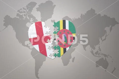 Puzzle heart with the national flag of dominica and england on a world ...