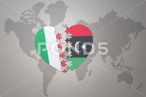 Puzzle heart with the national flag of libya and italy on a world map ...