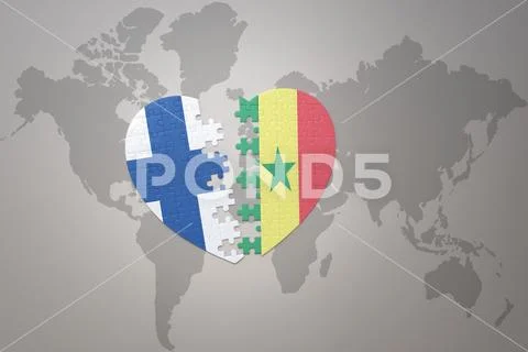 Puzzle heart with the national flag of senegal and finland on a world ...