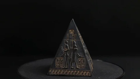 pyramid figure. pyramid figurine on a bl... | Stock Video | Pond5