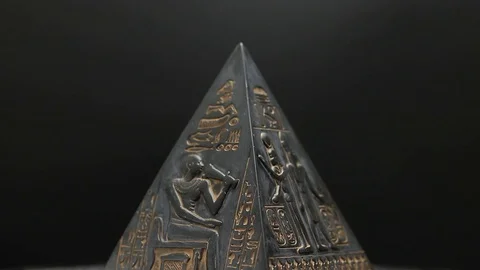 pyramid figure. pyramid figurine on a bl... | Stock Video | Pond5