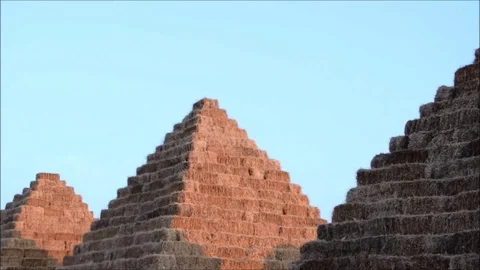 Pyramids made of straw with blue sky bac... | Stock Video | Pond5