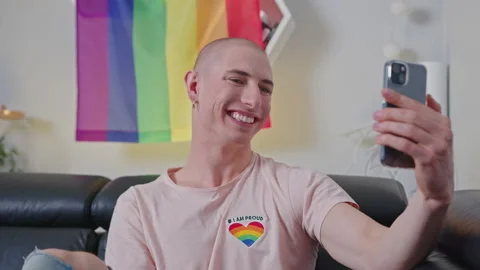 Queer non-binary bald influencer takes a... | Stock Video | Pond5