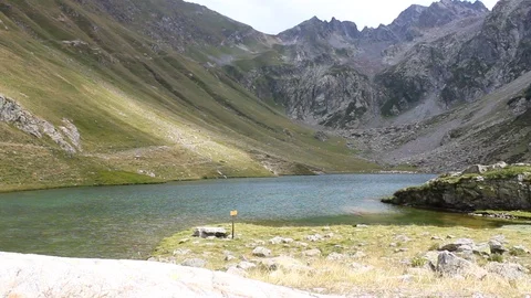 Quite mountain lake inside the valley, w... | Stock Video | Pond5