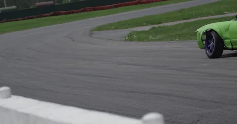 Race cars drifting on a track at a motor... | Stock Video | Pond5
