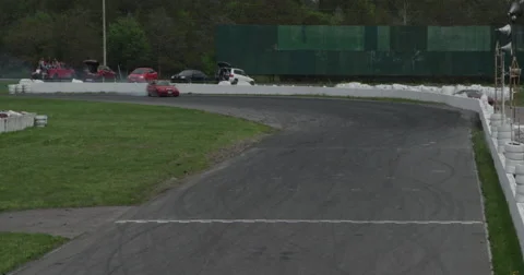 Race cars drifting on a track at a motor... | Stock Video | Pond5