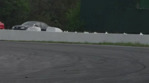 Race cars drifting on a track at a motor... | Stock Video | Pond5