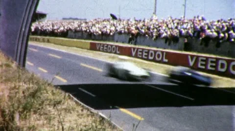 RACE CARS SPEED PAST Racetrack Crowds 19... | Stock Video | Pond5