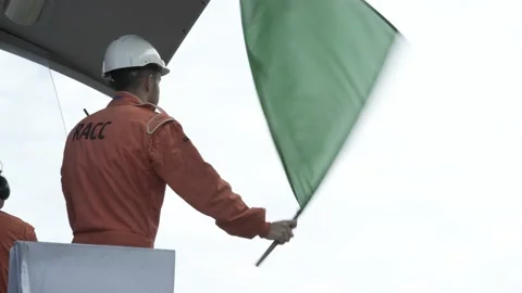 Race Official Flag Man Waves Green Flag | Stock Video | Pond5