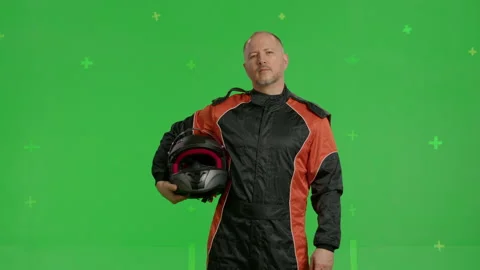 racer in a racing suit on green screen b... | Stock Video | Pond5
