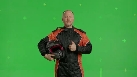 racer in a racing suit on green screen b... | Stock Video | Pond5
