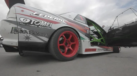 Racing car on the parking - filmed with ... | Stock Video | Pond5