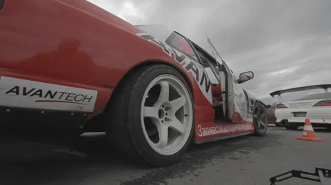 Racing car on the parking - filmed with ... | Stock Video | Pond5