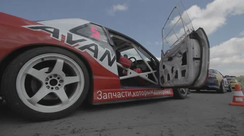 Racing car on the parking - filmed with ... | Stock Video | Pond5