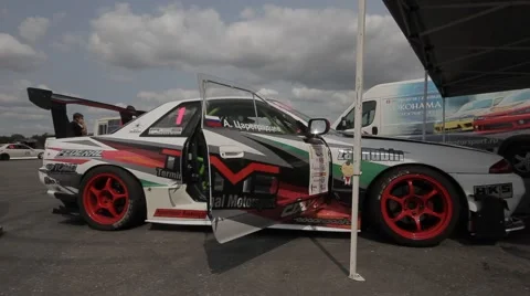 Racing car on the parking - filmed with ... | Stock Video | Pond5