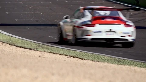 Racing car rear view coming out of the c... | Stock Video | Pond5