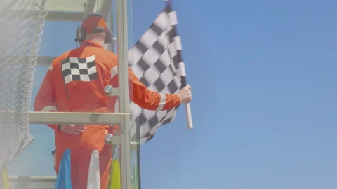 Racing marshal holding and waving Checke... | Stock Video | Pond5