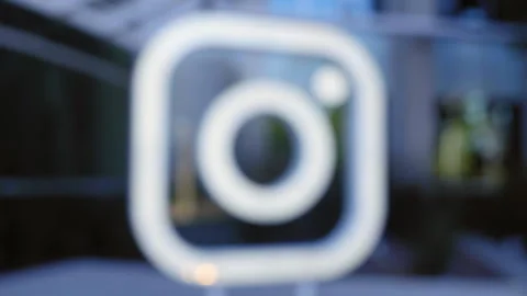 Rack focus reveal of Instagram Icon at I... | Stock Video | Pond5