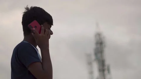 Rack focus shot of an Indian kid talking... | Stock Video | Pond5