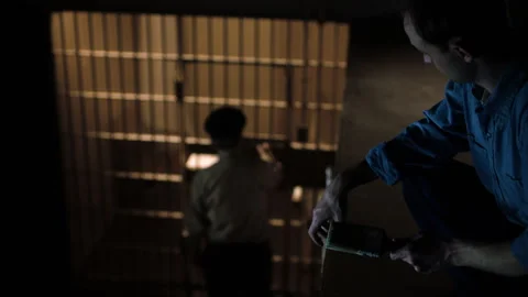 Rack focus shot of an inmate watching pr... | Stock Video | Pond5